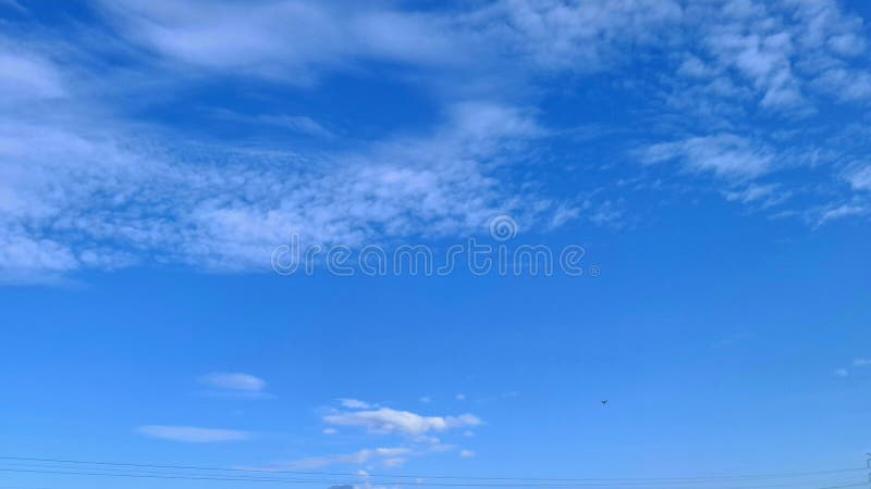 Blue Sky with Some Clouds Blown by the Wind into a Beautiful Shape ...
