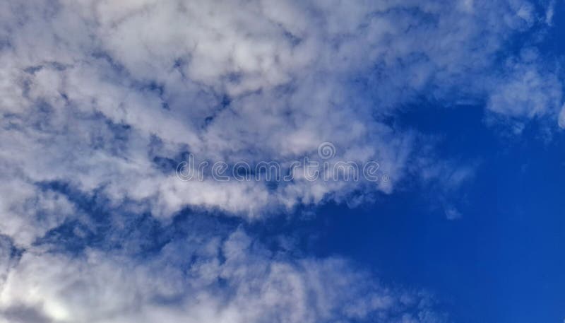 Blue Sky with Some Clouds Blown by the Wind into a Beautiful Shape ...