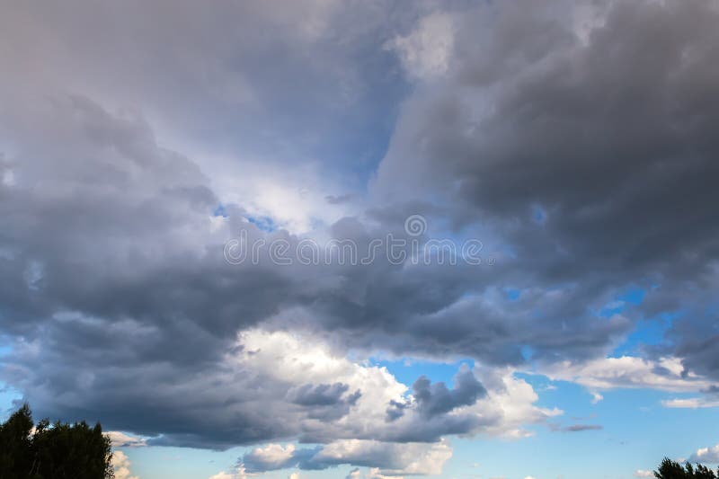 Blue Sky with Storm Clouds Over the Deciduous Tree Tops Stock Image ...