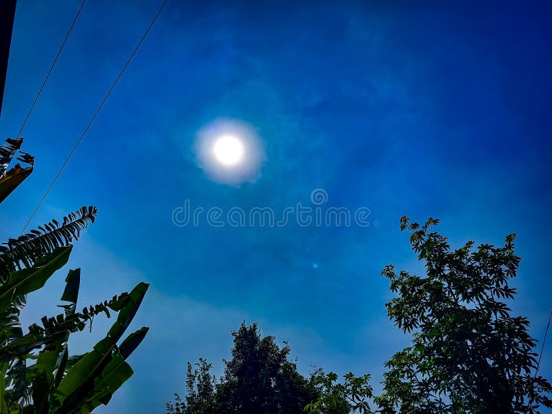 Blue Sky with Sun at Noon with Low Lighting Stock Image - Image of ...