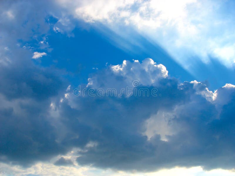 Blue Sky with Sun Rays through the Clouds Stock Image - Image of ...