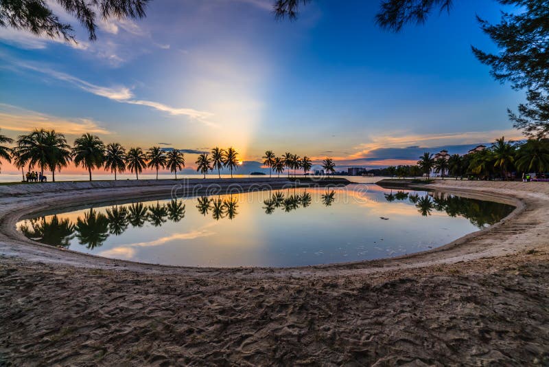 Blue Sky with Sun Rays during Sunset Over the Beach Stock Image - Image ...