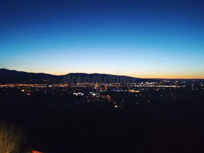 Blue Sky Sunset Over Glowing City Lights Stock Image - Image of lights ...