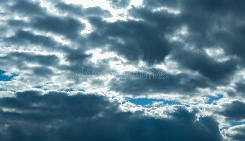 Blue Sky with Thunderclouds. the Sun Breaks through Clouds. Black ...