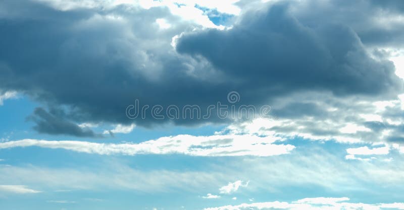 Blue Sky with Thunderclouds. the Sun Breaks through Clouds. Black ...