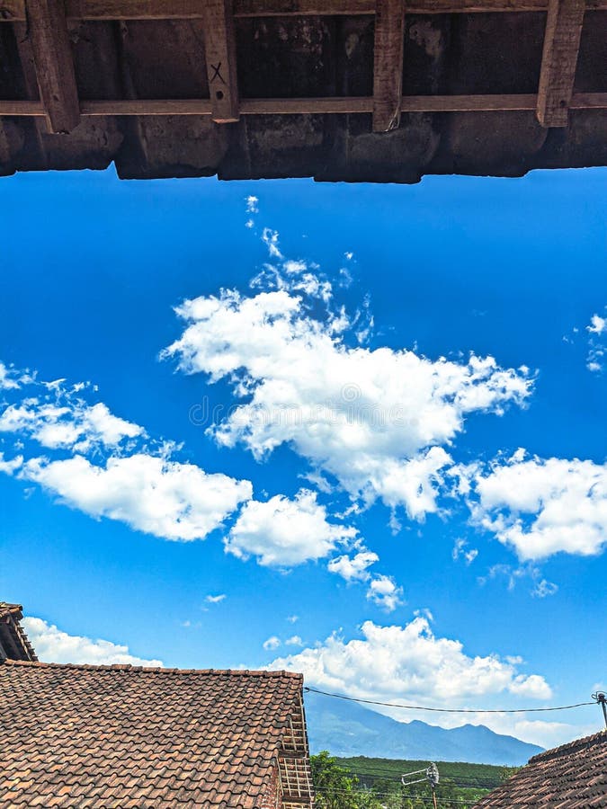 Blue Sky White Clouds Gather at a Point Above the Countryside with a ...