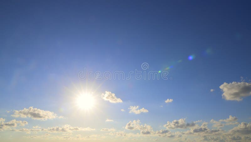 Blue Sky with White Clouds and Sun Reflection. the Sun Shines Bright in ...