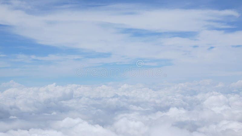 Blue Sky with White Fluffy Clouds from Airplane Flight Fly Over the ...