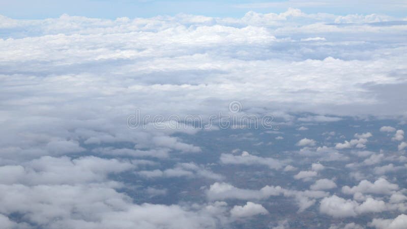 Blue Sky with White Fluffy Clouds from Airplane Flight Fly Over the ...