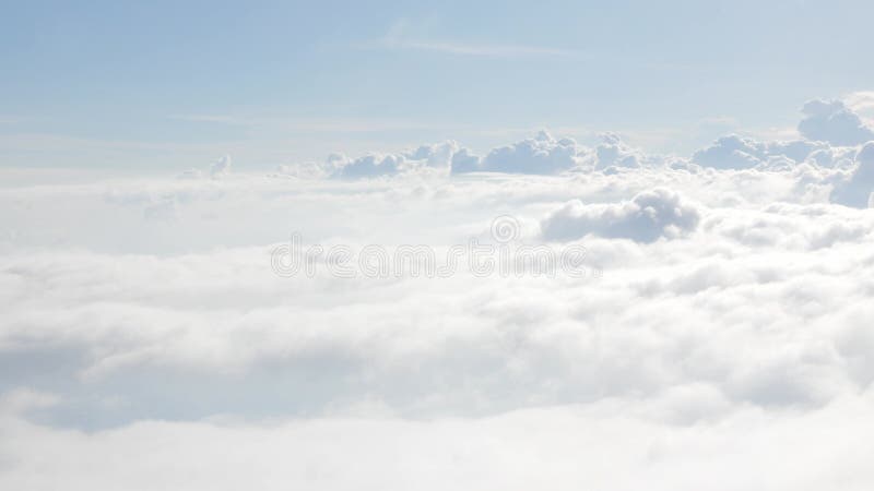 Blue Sky with White Fluffy Clouds from Airplane Flight Fly Over the ...