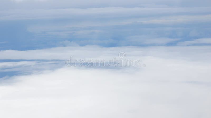Blue Sky with White Fluffy Clouds from Airplane Flight Fly Over the ...