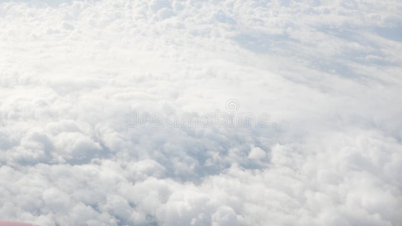 Blue Sky with White Fluffy Clouds from Airplane Flight Fly Over the ...