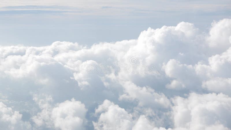 Blue Sky with White Fluffy Clouds from Airplane Flight Fly Over the ...