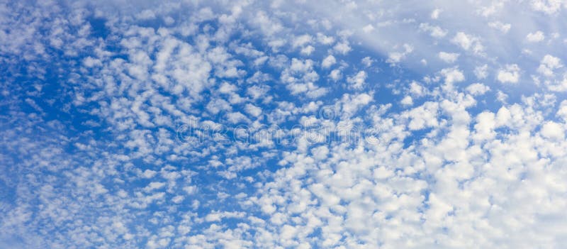 Blue Sky with White Scattered Clouds Background. Stock Photo - Image of ...