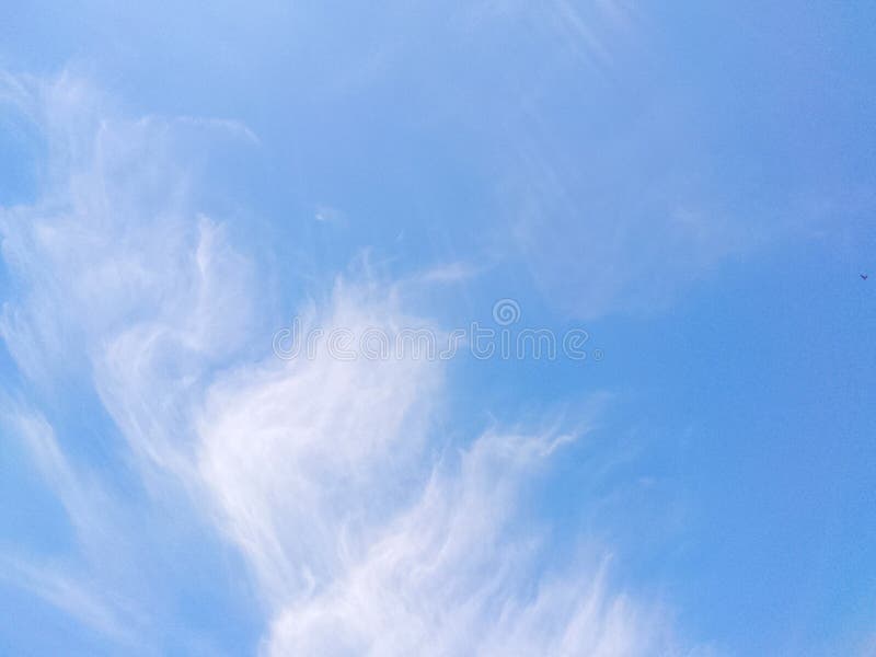 Blue Sky with Wispy White Clouds - Clear Day Background Stock Image ...
