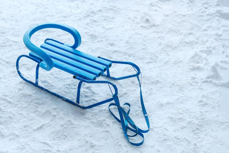 Blue Sledges in the Snow. Winter Activities for Children Stock Image ...