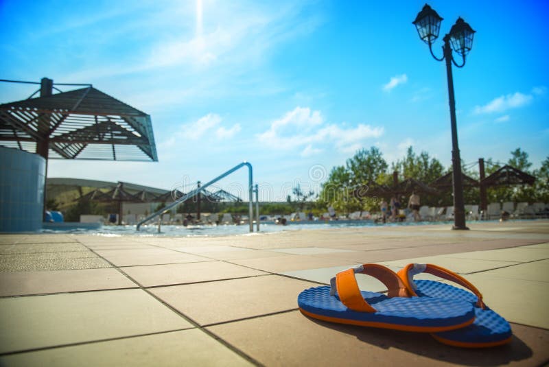 Blue Slippers Near Swimming Pool at Poolside Stock Photo - Image of ...
