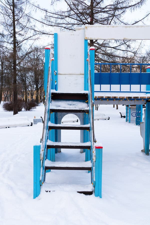 Blue Snow Covered Ladder Part of Playground among Coniferous Trees ...