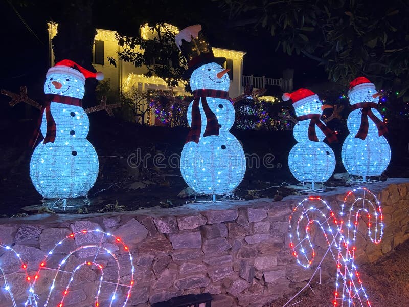 Blue Snowman at Night with Candy Canes Stock Photo - Image of seasonal ...