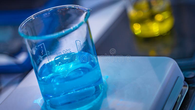 Blue Solution in Glass Beaker Stock Photo - Image of fluid, industry ...