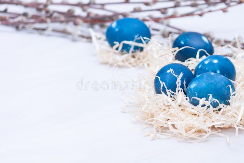 Blue Space Easter Eggs in Nest on White Wooden Background. Close Up ...