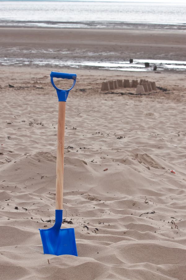Blue Spade with Sandcastles Stock Photo - Image of coast, bright: 20555062