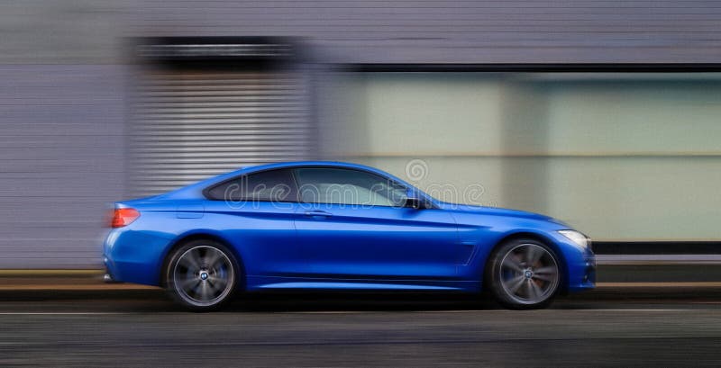 Blue Speedy Car Moving on the Road Motion Blurred Image Stock Photo ...