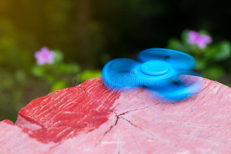 Blue Spinner Hand with Red Stump. Stock Photo - Image of spinner ...