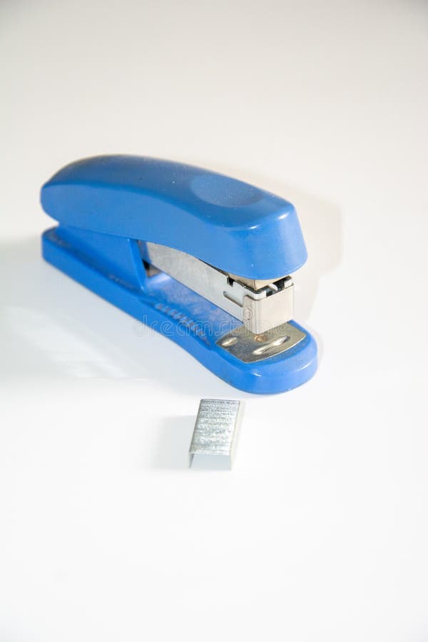 Blue Stapler and One Staple Placed on a White Background Stock Image ...