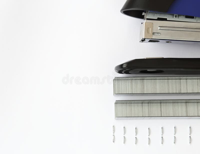 Staples in a stapled paper stock image. Image of equipment - 70104939