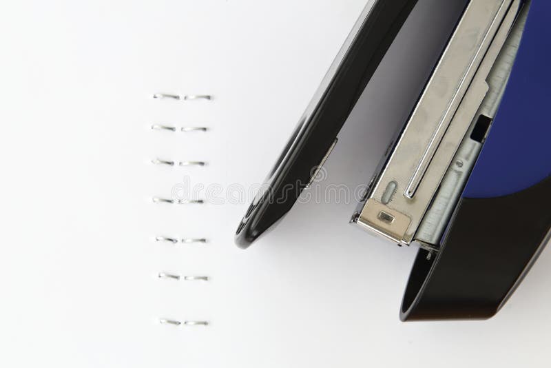 Staples in a stapled paper stock image. Image of equipment - 70104939