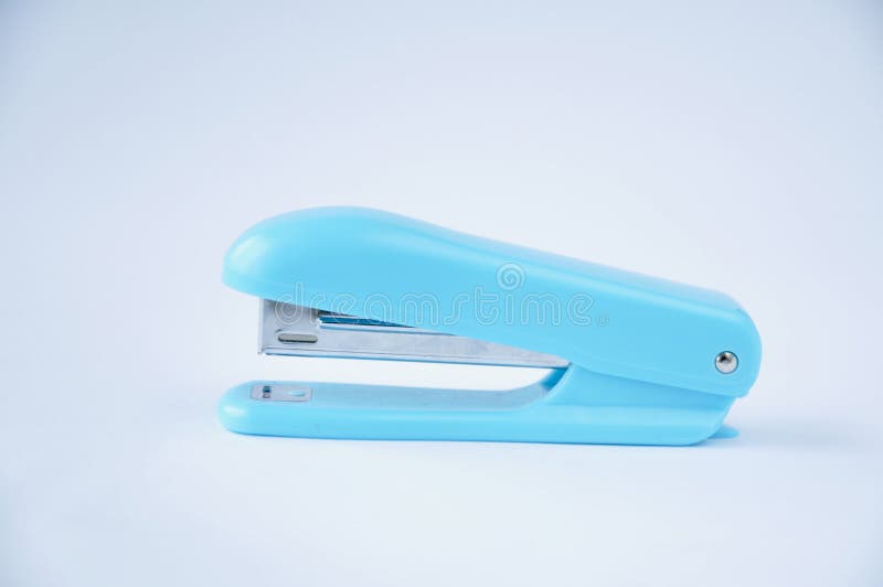 Blue Stapler on White Table Stock Image - Image of plastic, staplers ...