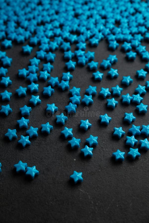 Blue Star Sugar Sprinkles Scattered on Dark Stock Photo - Image of ...