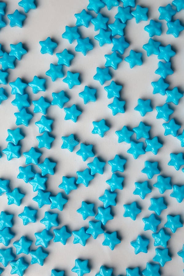 Blue Star Sugar Sprinkles Scattered on White Stock Image - Image of ...