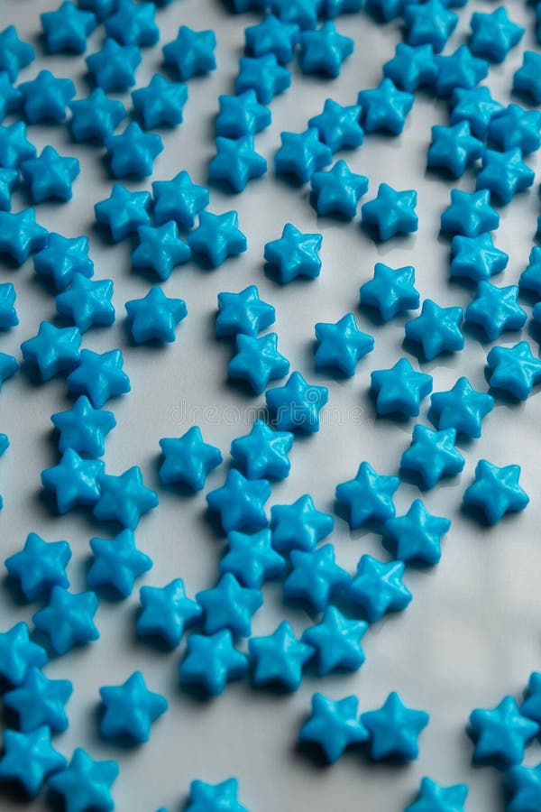 Blue Star Sugar Sprinkles Scattered on White Stock Photo - Image of ...