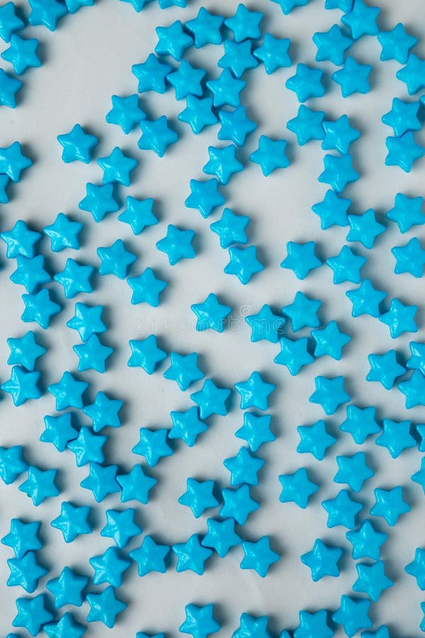 Blue Star Sugar Sprinkles Scattered on White Stock Image - Image of ...