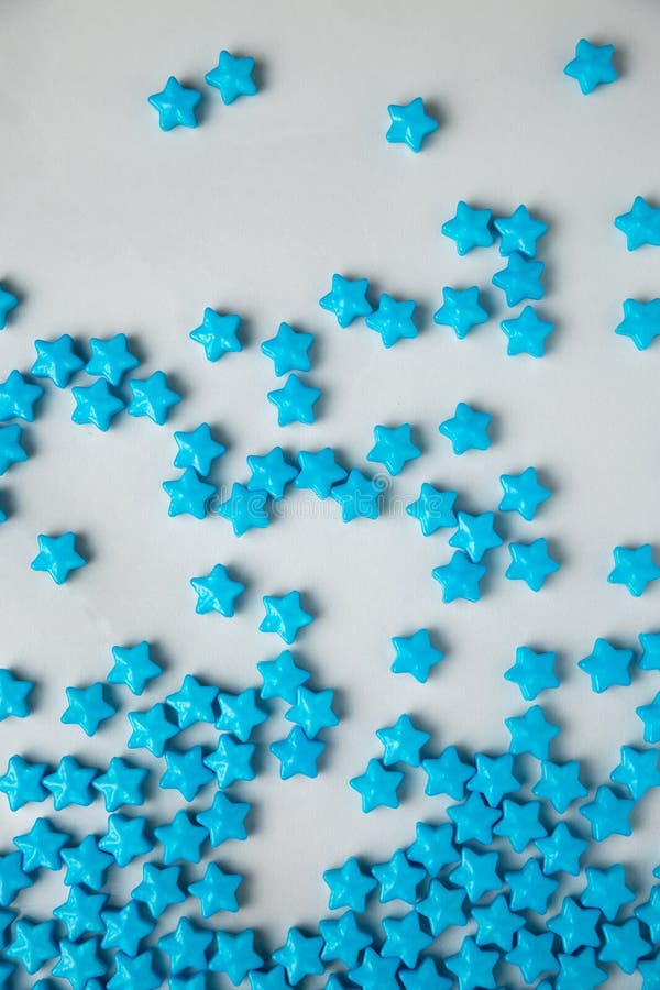 Blue Star Sugar Sprinkles Scattered on White Stock Image - Image of ...