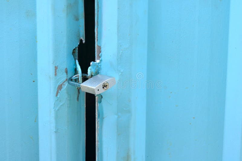 Blue Steel Door and Locked with Steel Key Stock Photo - Image of green ...