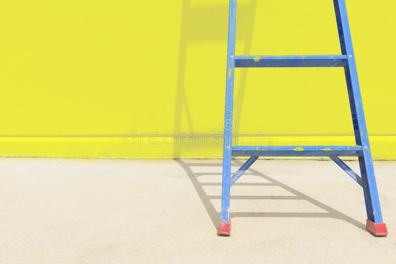 The Blue Steel Ladder with the Yellow Wall Stock Image - Image of floor ...