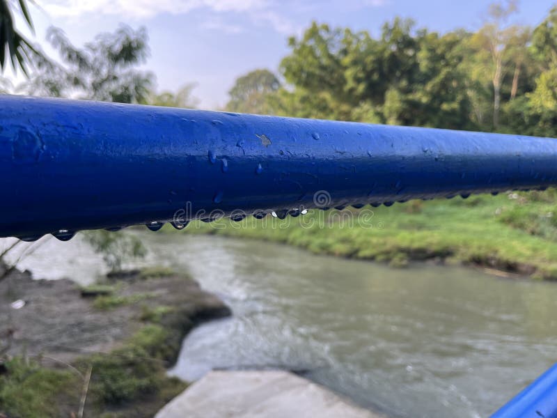 Railing with Water Drops and Wet in the Park. Stock Photo - Image of ...