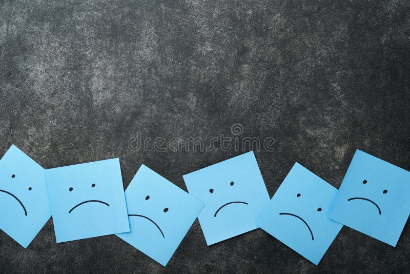 Blue Sticky Notes Blank with Drawing Sad Face on Black Background with ...