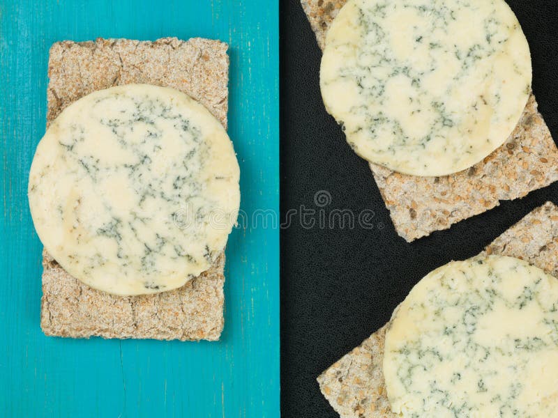Blue Stilton Cheese on Thin Crisp Wholewheat Crackers Stock Photo ...