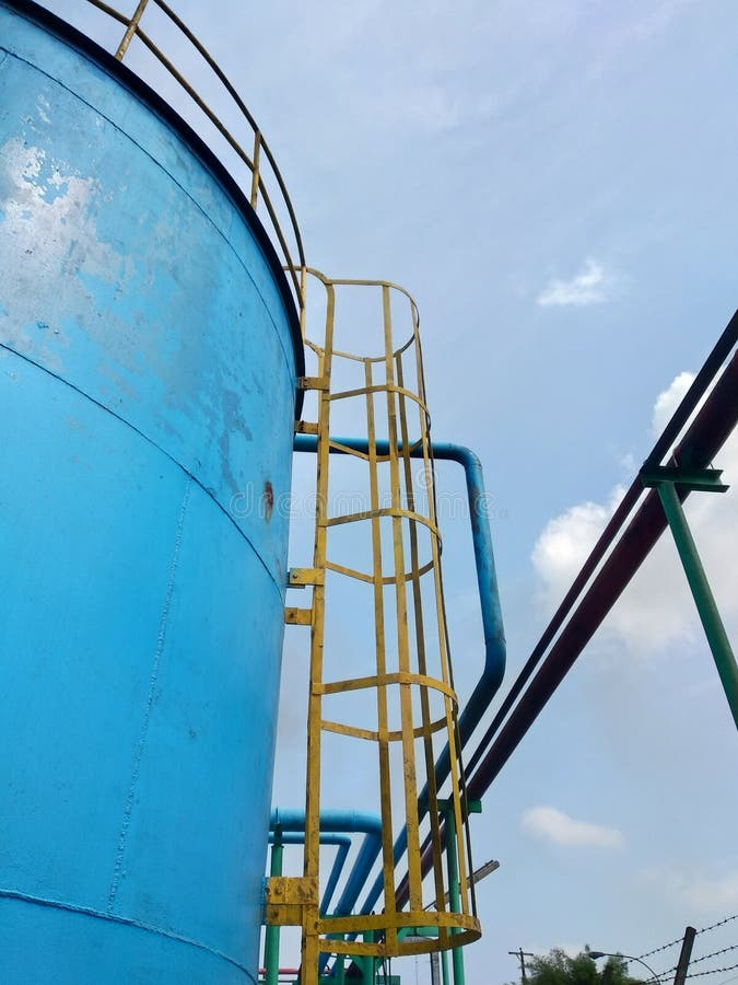 Blue Storage Tank with a Monkey Ladder Attached on it Stock Image ...