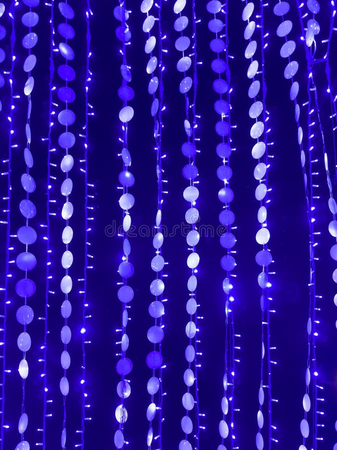 Blue String Lights and Circular Hanging Decorations Form a Striking ...