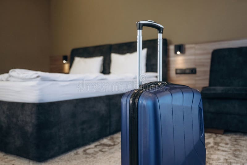 Blue Suitcase in the Modern Hotel Room Near the Bed Stock Image - Image ...