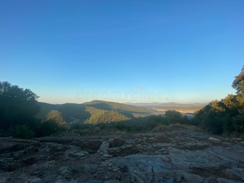 Blue Sunny Sky on a Sunrise Landscape of a Bright Green Mountain and ...