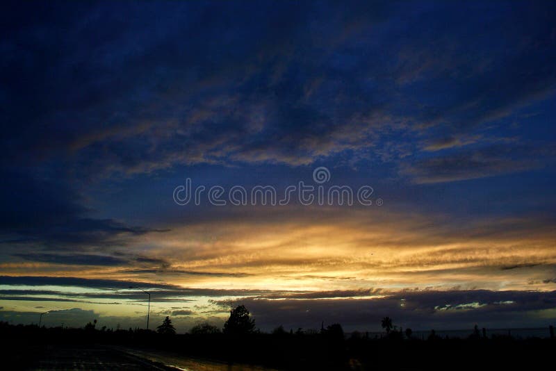 Blue sunset stock photo. Image of clouds, blue, yellow - 114928998