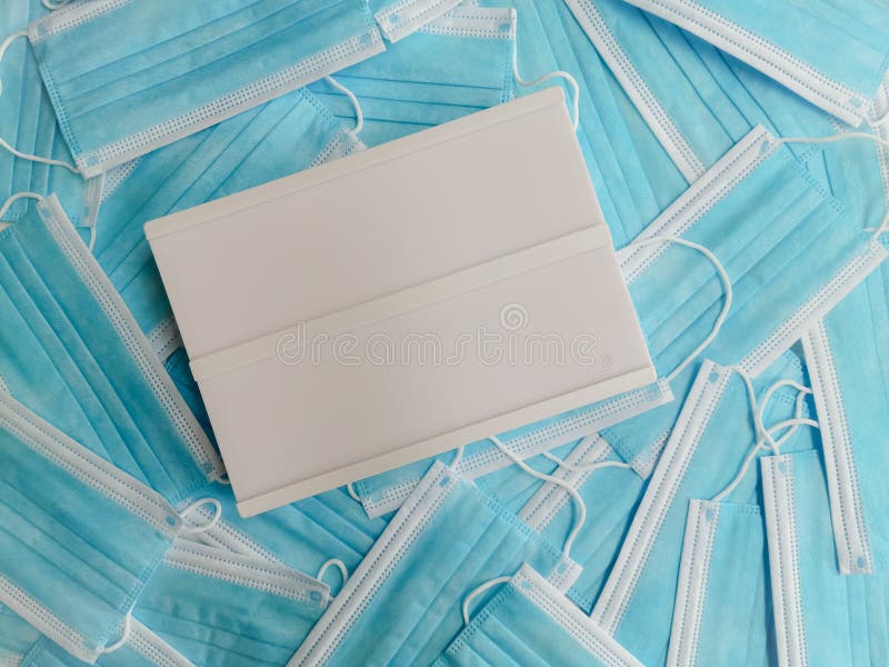 Blue Surgical Face Masks with an Empty White Light Box Stock Image ...