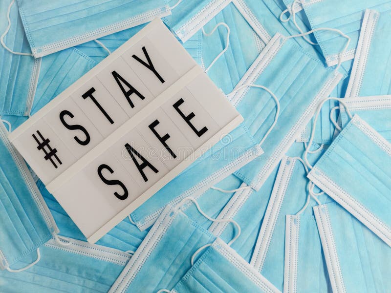 Blue Surgical Face Masks with a White Letterbox Stating # Stay Safe ...