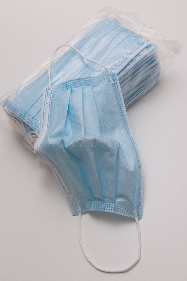 Blue Surgical Masks in a White Table Stock Image - Image of package ...